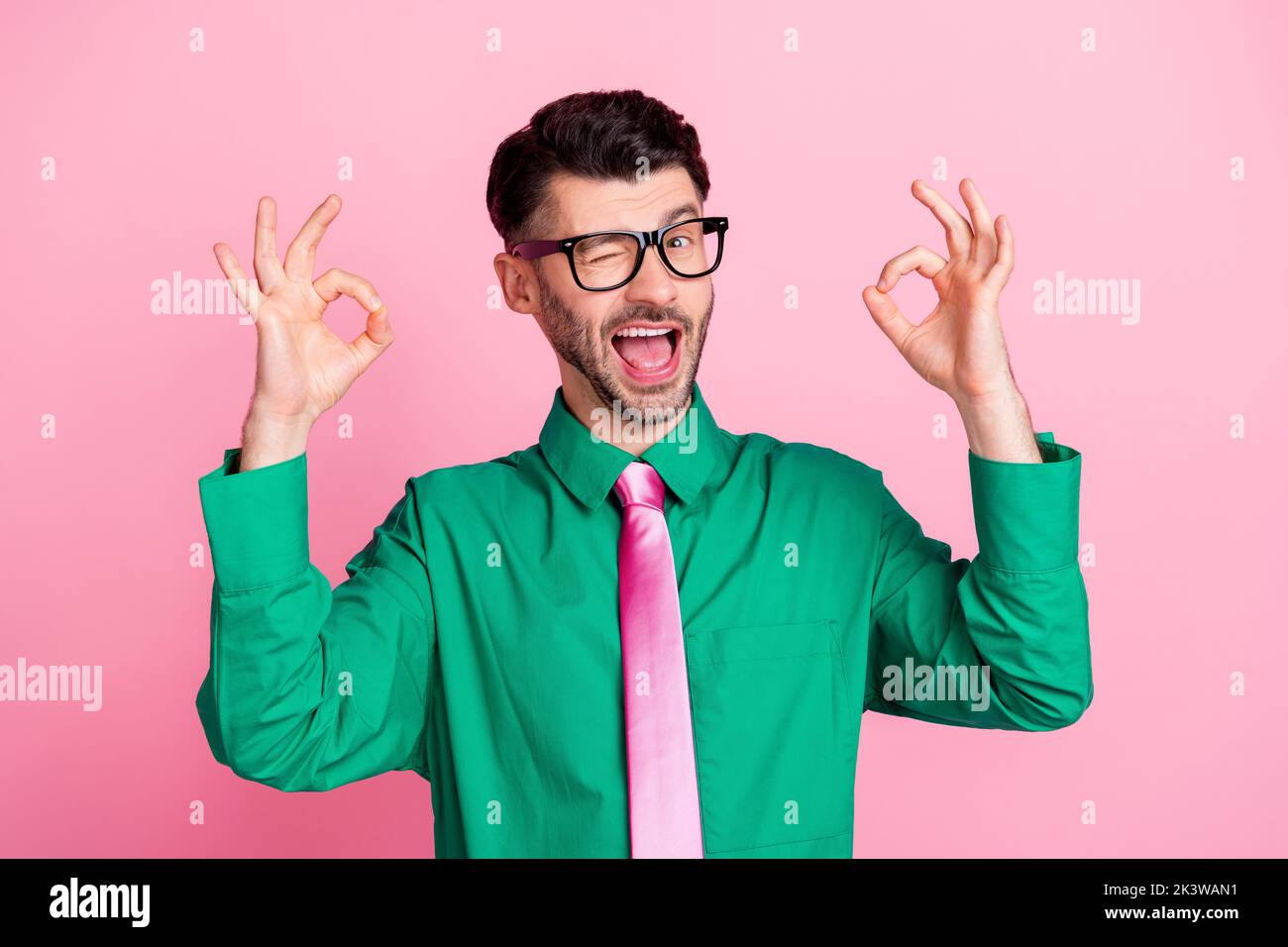 Closeup photo of young handsome guy showing two hands okey sign ...