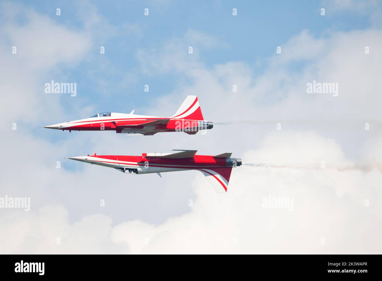 Telephoto lens close up of two jet fighters flying very close to each ...
