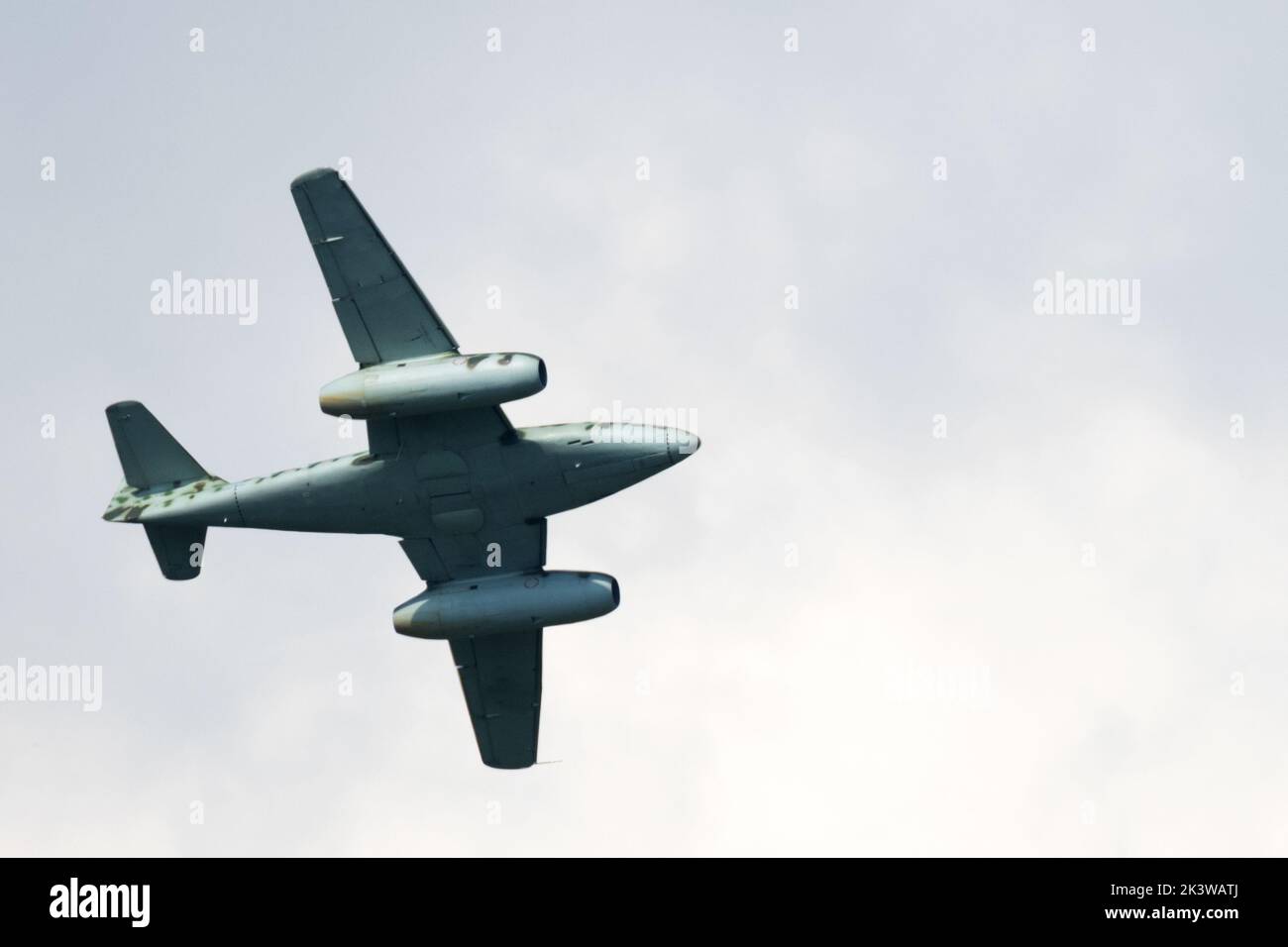 Telephoto lens close up old jet fighter at air show against cloudy sky ...