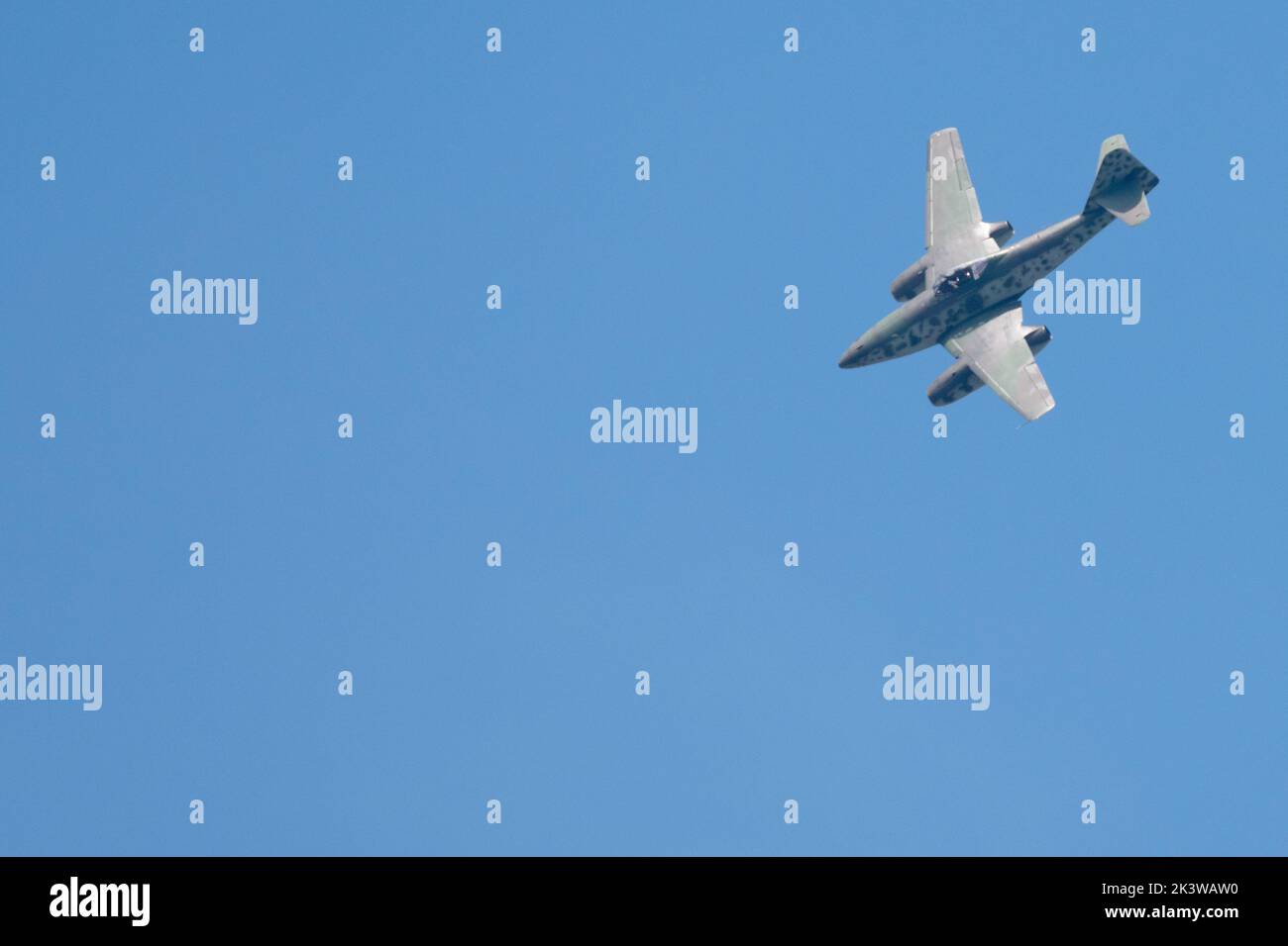 Plunge of historical old fighter jet against blue sky at air show as ...