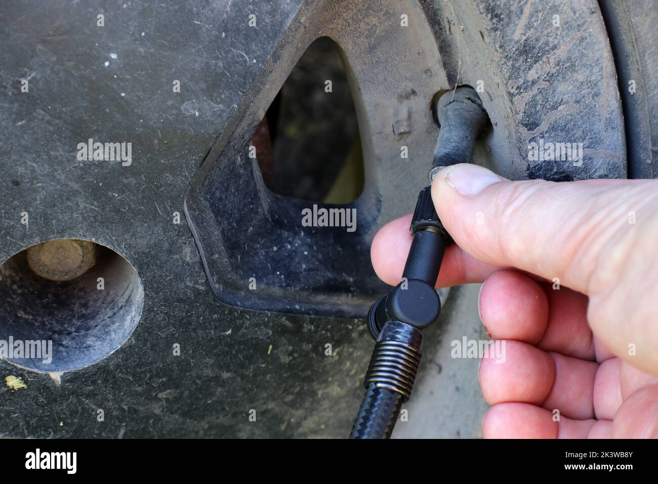 Car service. Checking wheel pressure. Vehicle maintenance Stock Photo ...