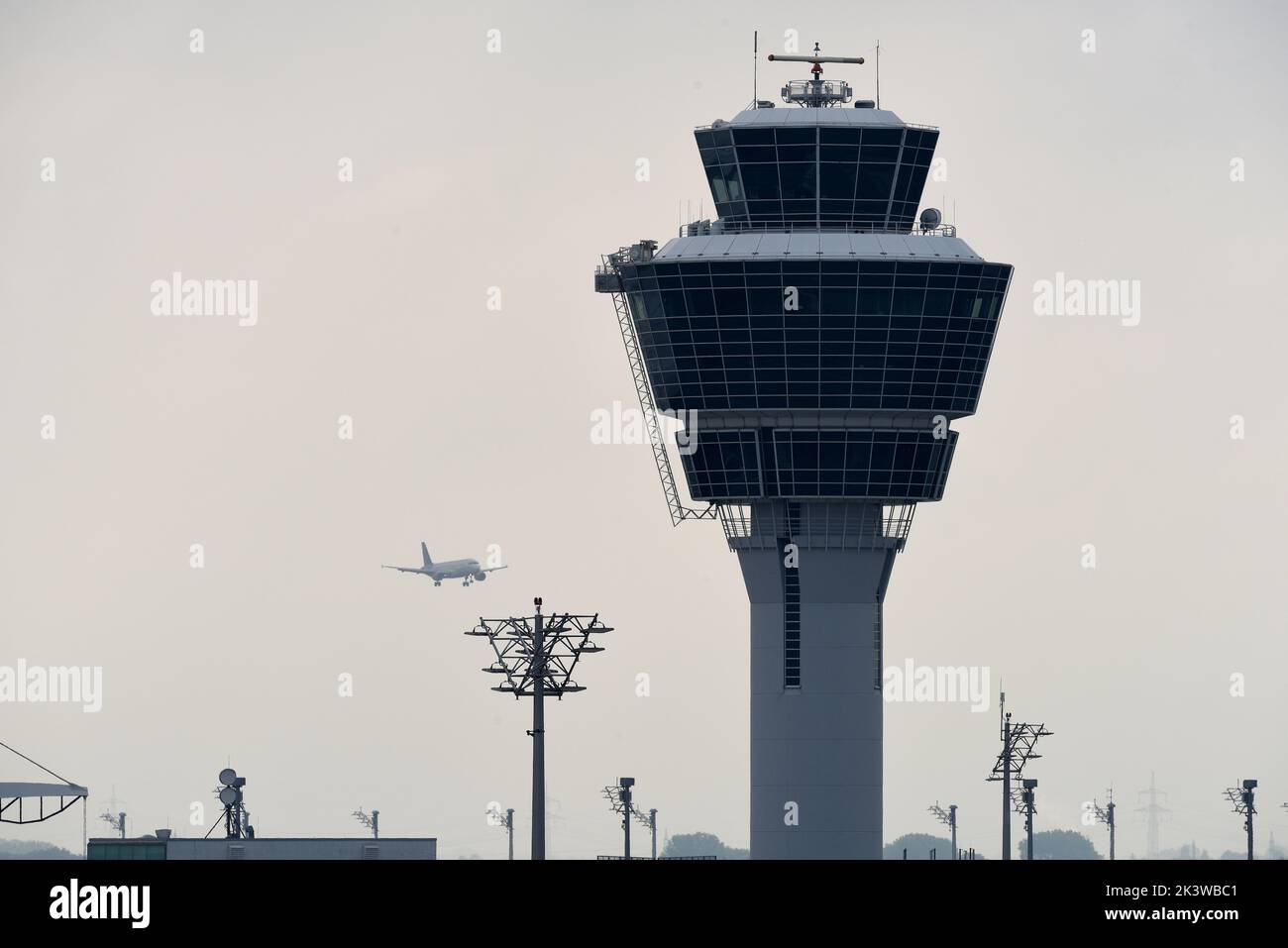 Close up of modern aircraft tower at airport with passenger aircraft ...