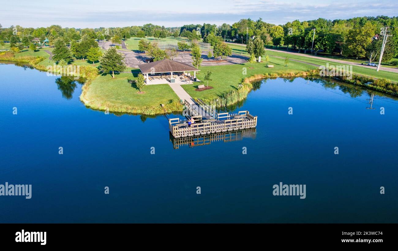 Dock and shelter on a pond Stock Photo - Alamy