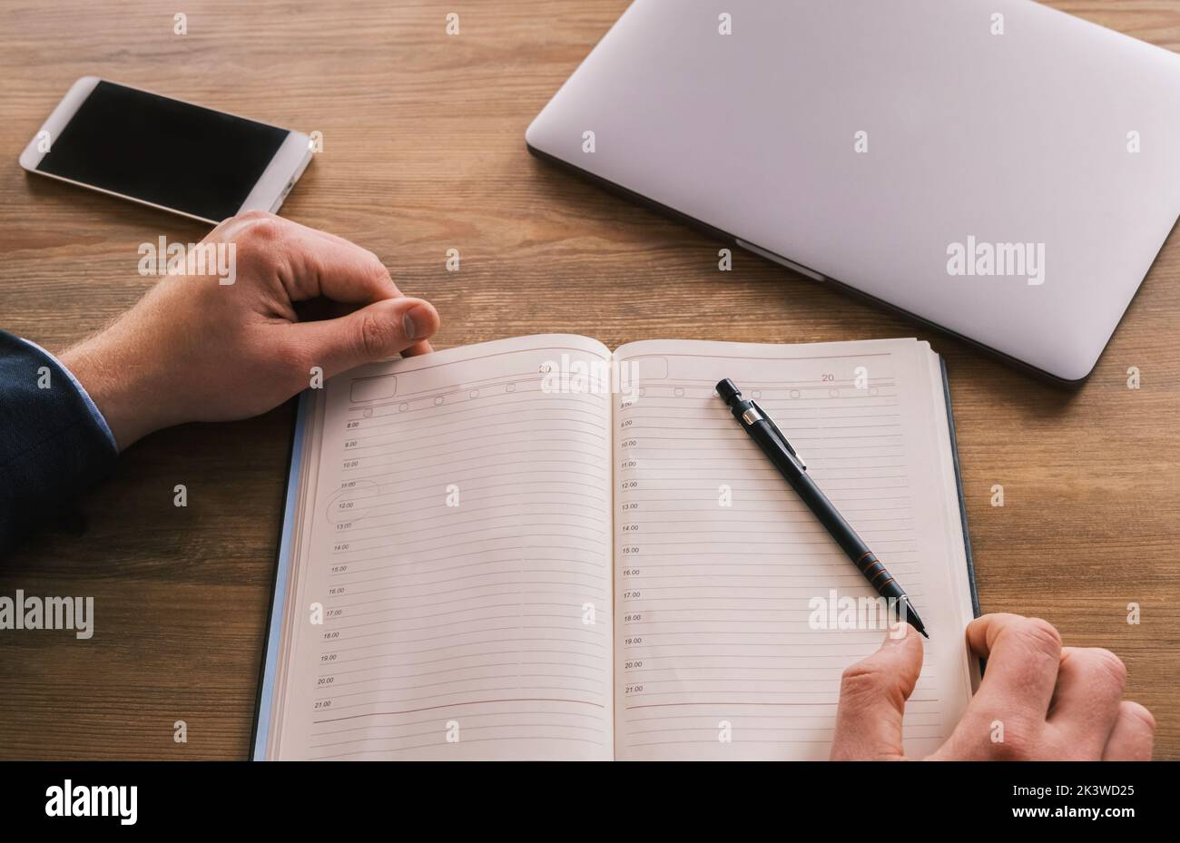 Close up top view of businessman writing in notebook, caucasian male ...