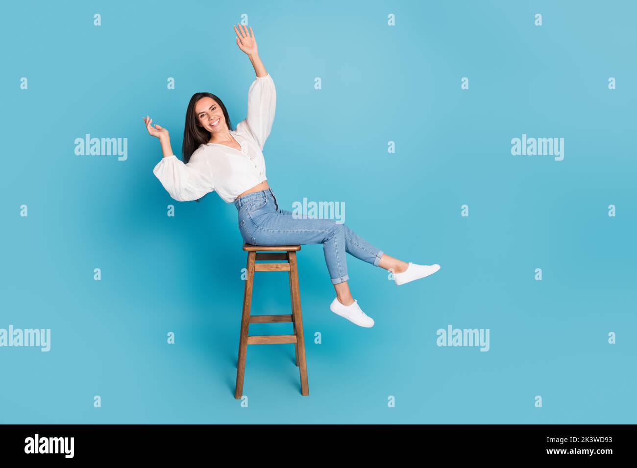 Full length profile portrait of overjoyed lovely girl sit stool raise ...