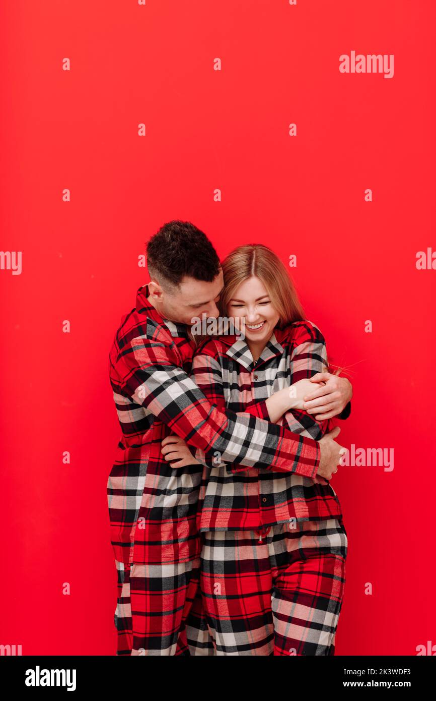 Happy Saint Valentine's Day. Young couple in the same pyjamas is ...
