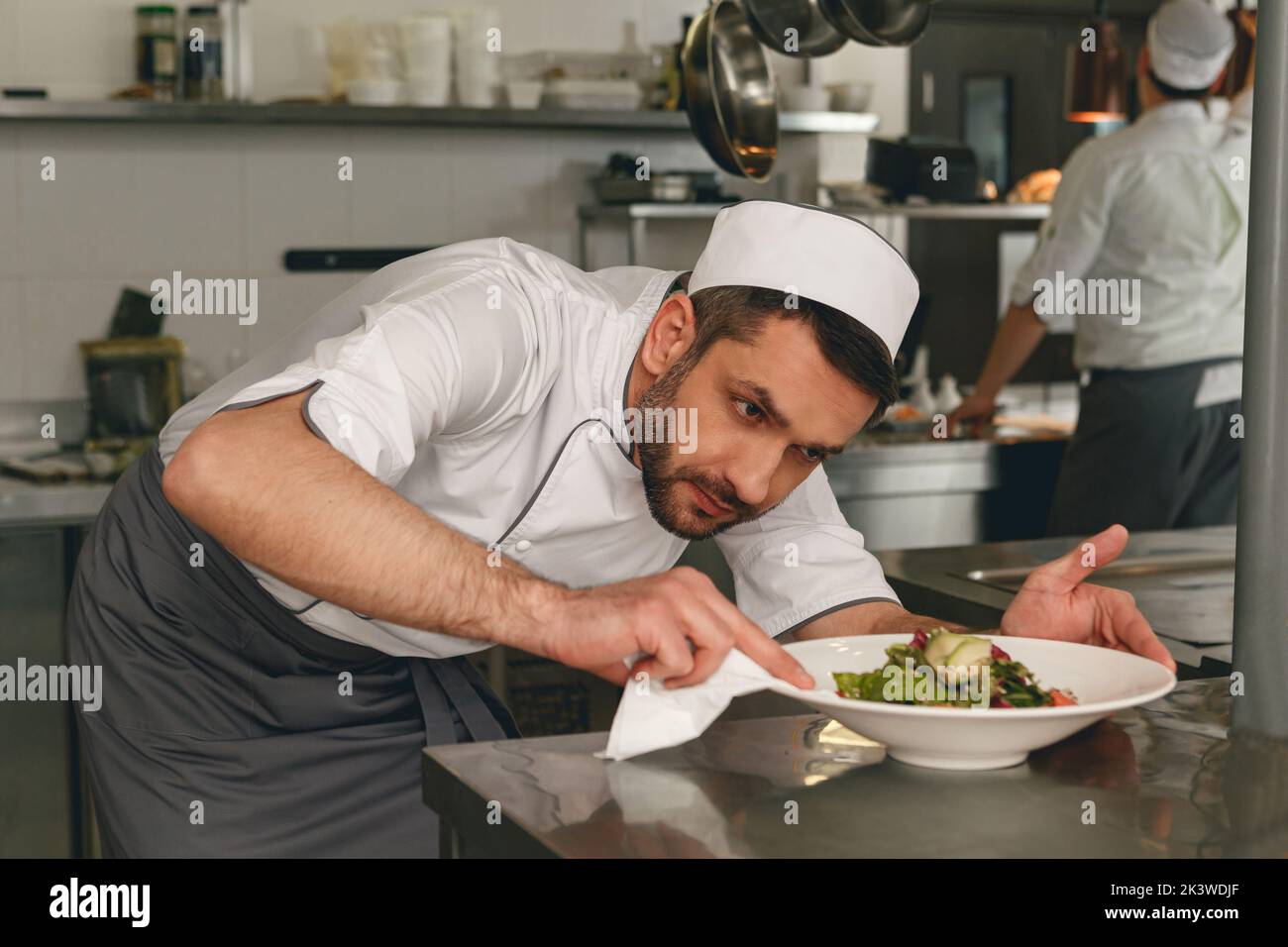 Chef preparing salad in the modern kitchen of restaurant. Tasty and ...