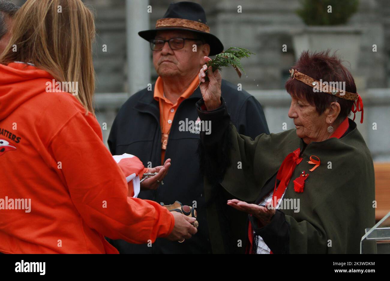 Telaxten (Paul Sam), left, looks on as T’Sooke Elder Shirley Alphonse ...