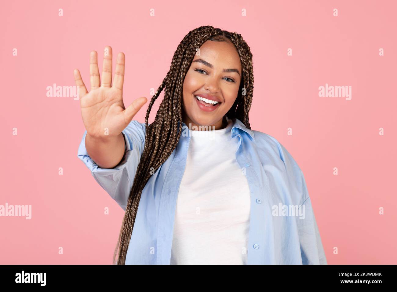 Happy Black Plus Size Woman Waving Hand On Pink Background Stock Photo ...