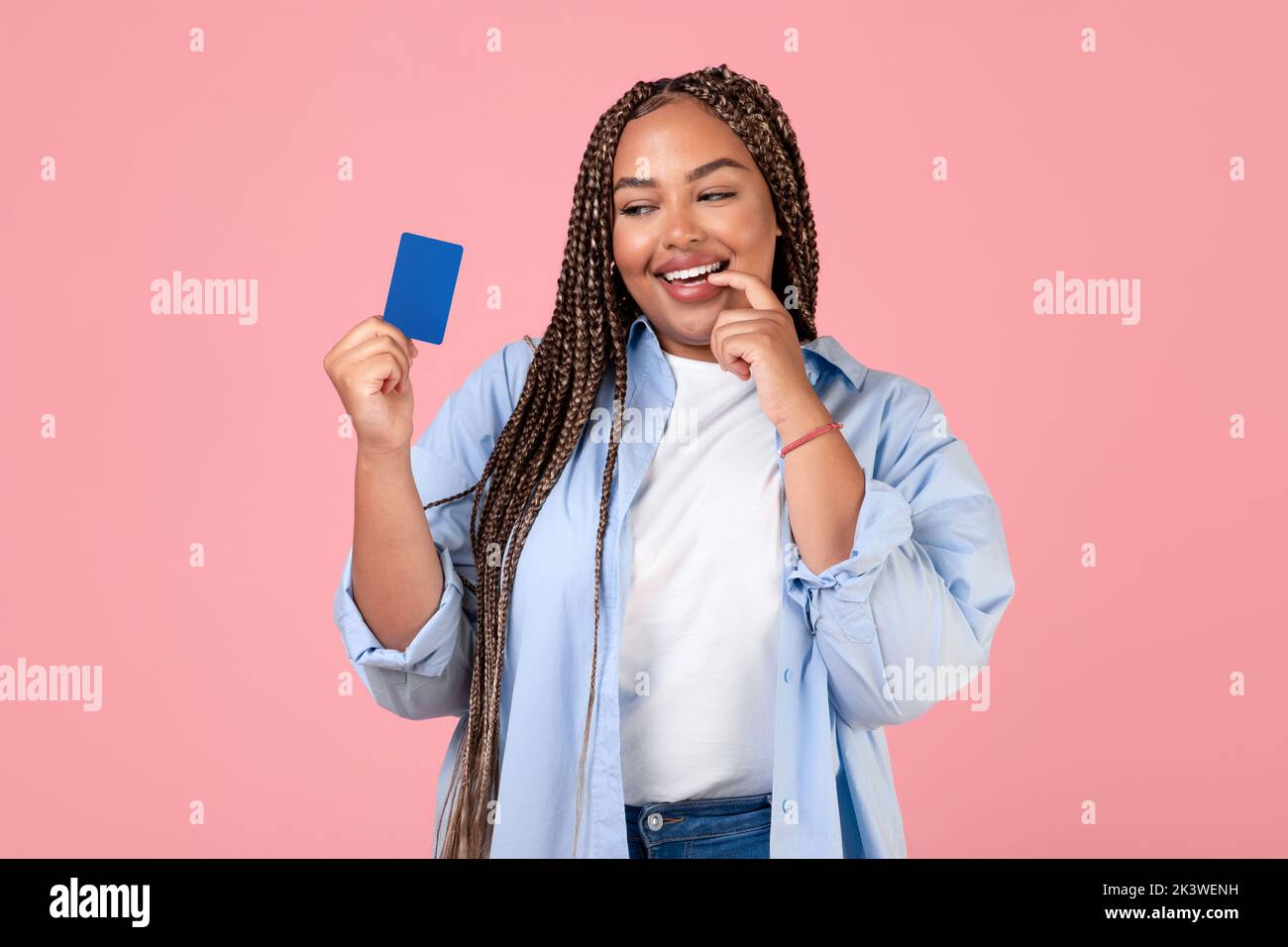 Playful African American Female Holding Credit Card Over Pink Background Stock Photo - Alamy