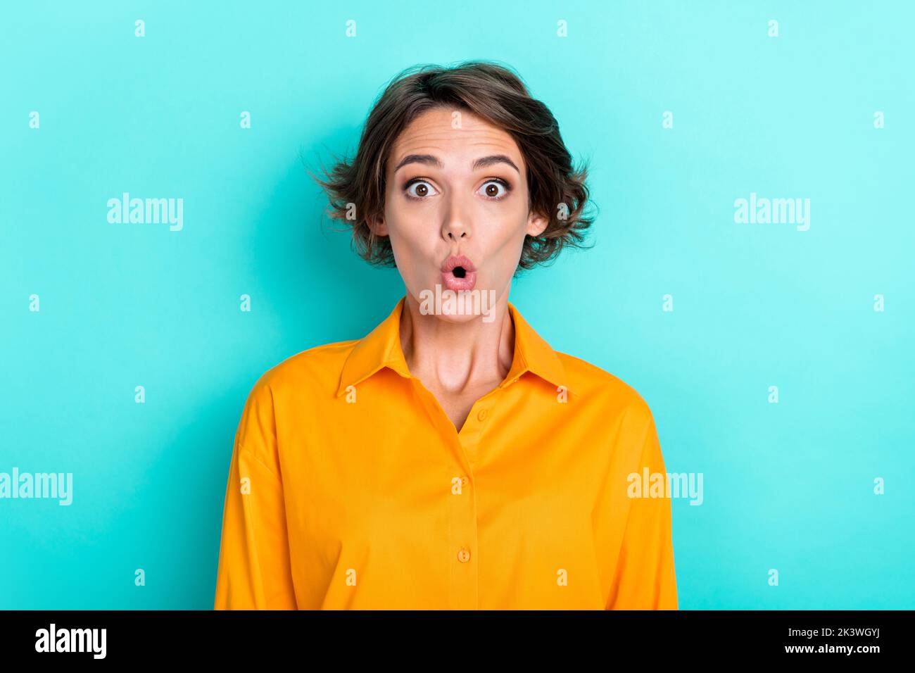 Photo of cute impressed excited girl with bob hairdo dressed yellow ...