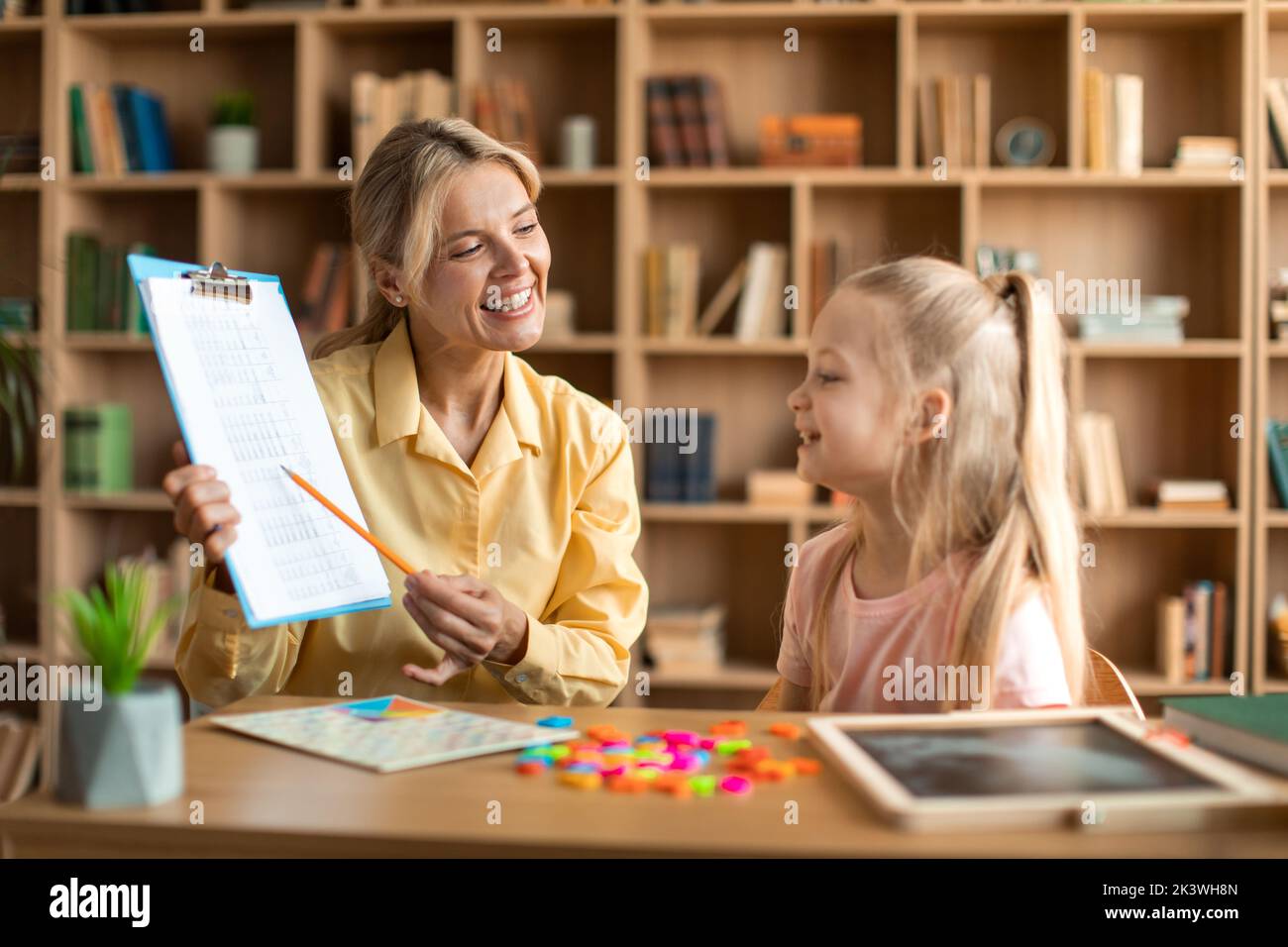 Girl preschooler visiting child psychologist, friendly woman child ...