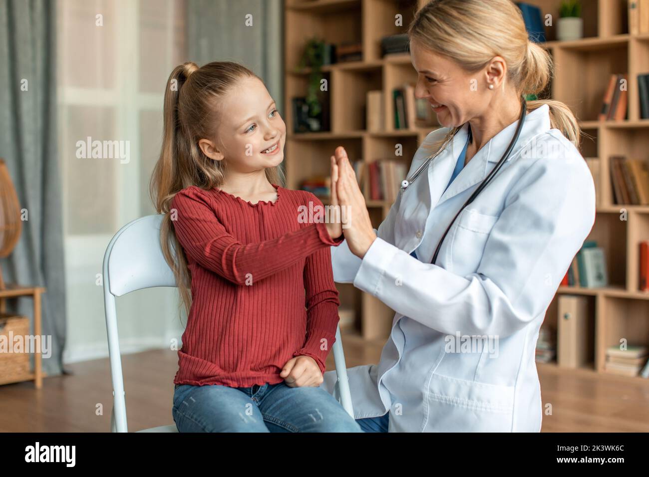 Little girl at appointment with friendly female doctor, healthy smiling ...