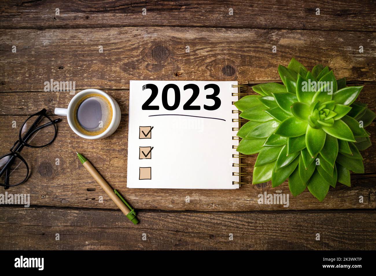 New year resolutions 2023 on desk. 2023 resolutions list with notebook ...