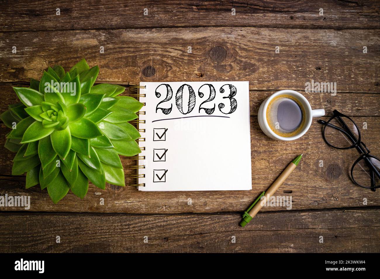 New year resolutions 2023 on desk. 2023 resolutions list with notebook ...