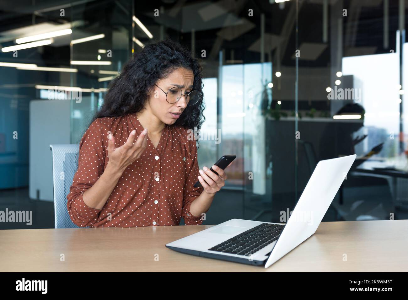Disappointed and sad woman looking at phone screen, reading bad news ...
