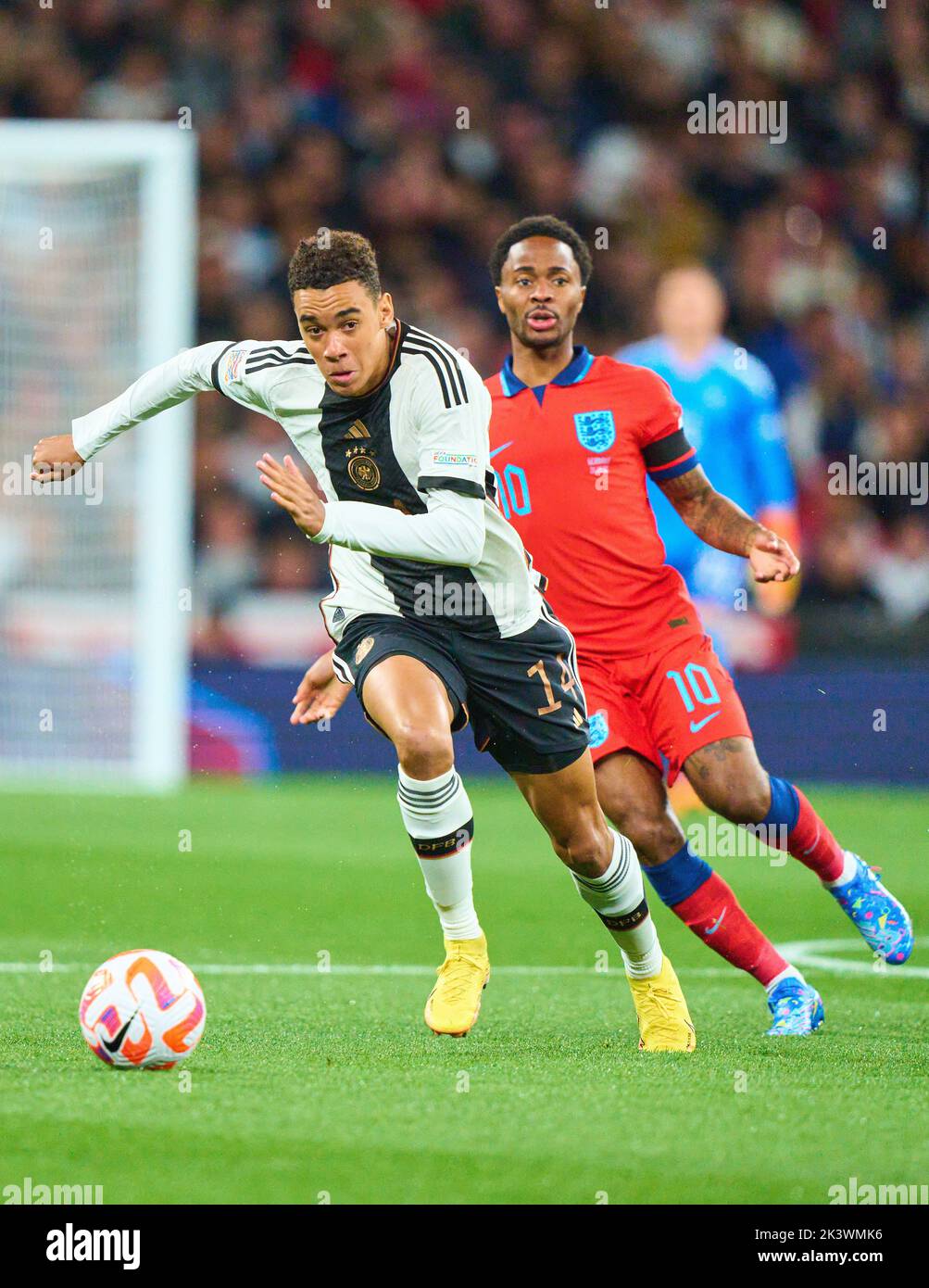 Jamal Musiala, DFB 14 compete for the ball, tackling, duel, header ...