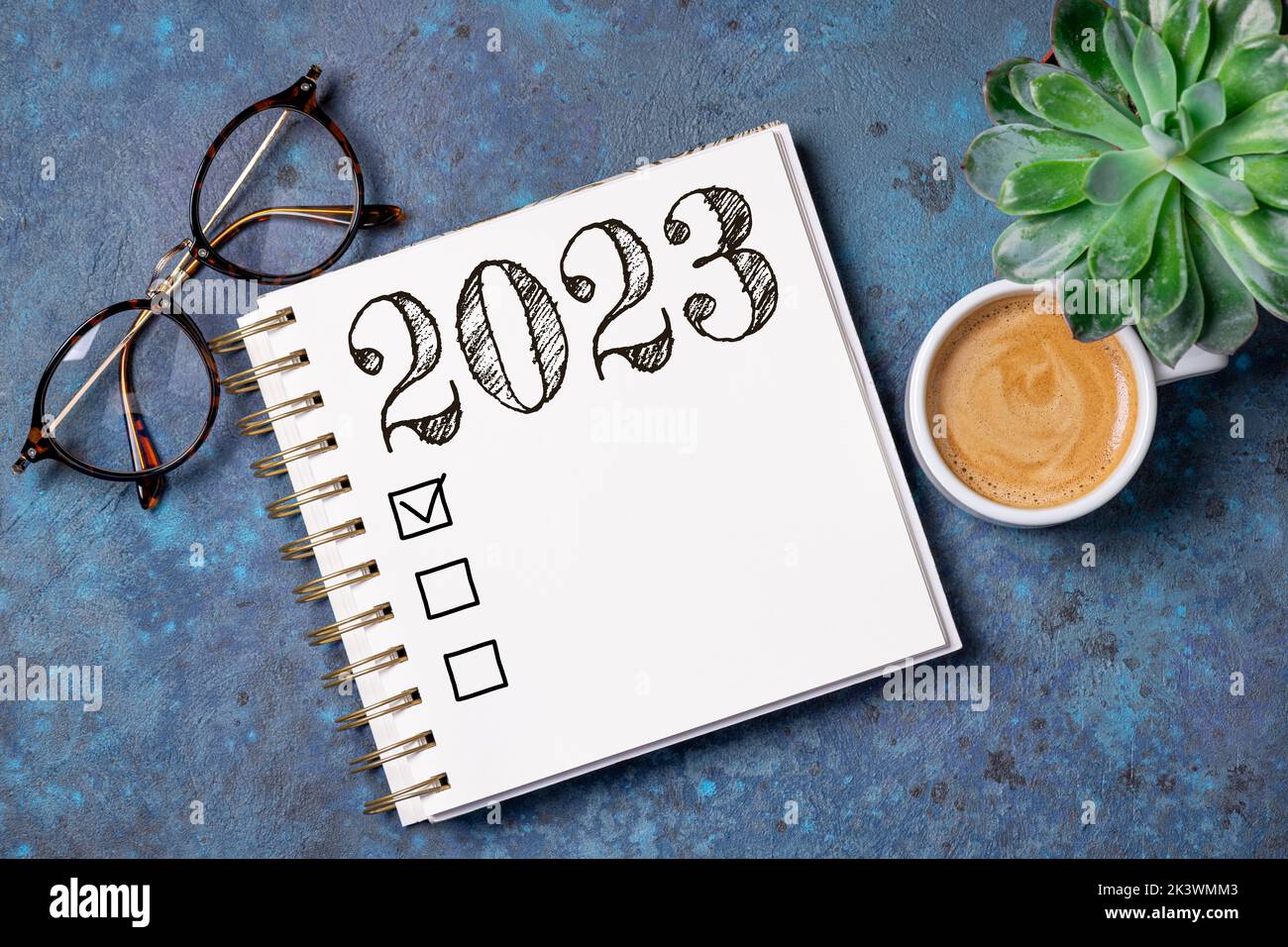 New year resolutions 2023 on desk. 2023 resolutions list with notebook ...