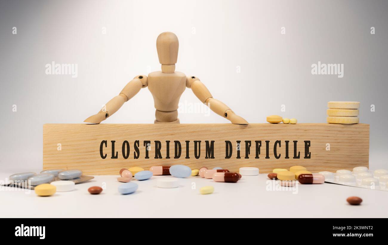 clostridium difficile disease. Written on wooden surface. On wood and ...
