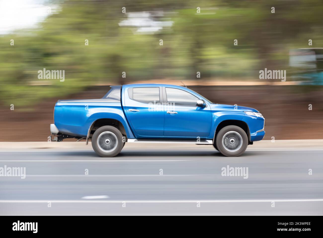Panning shot of a car driving on a highway. Blurred photo Stock Photo ...