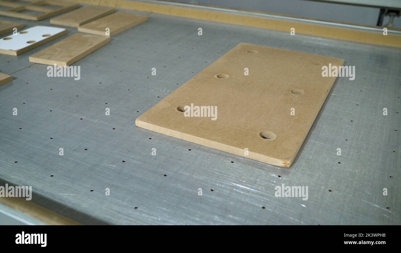 There is a stack of OSB sheets on the table. Construction material. OSB ...