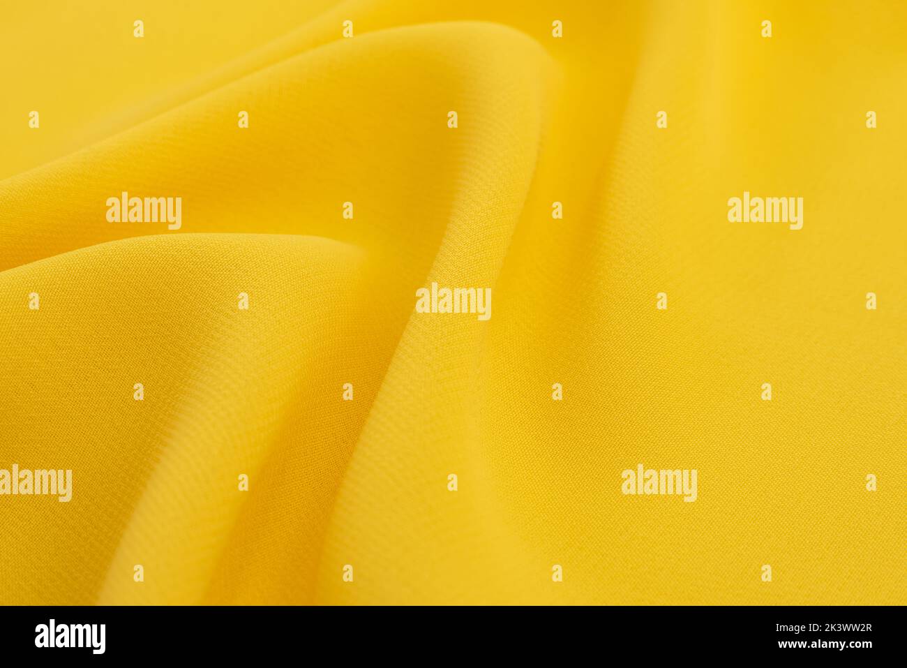 Texture of crumpled yellow fabric. Background of luxury textile or ...