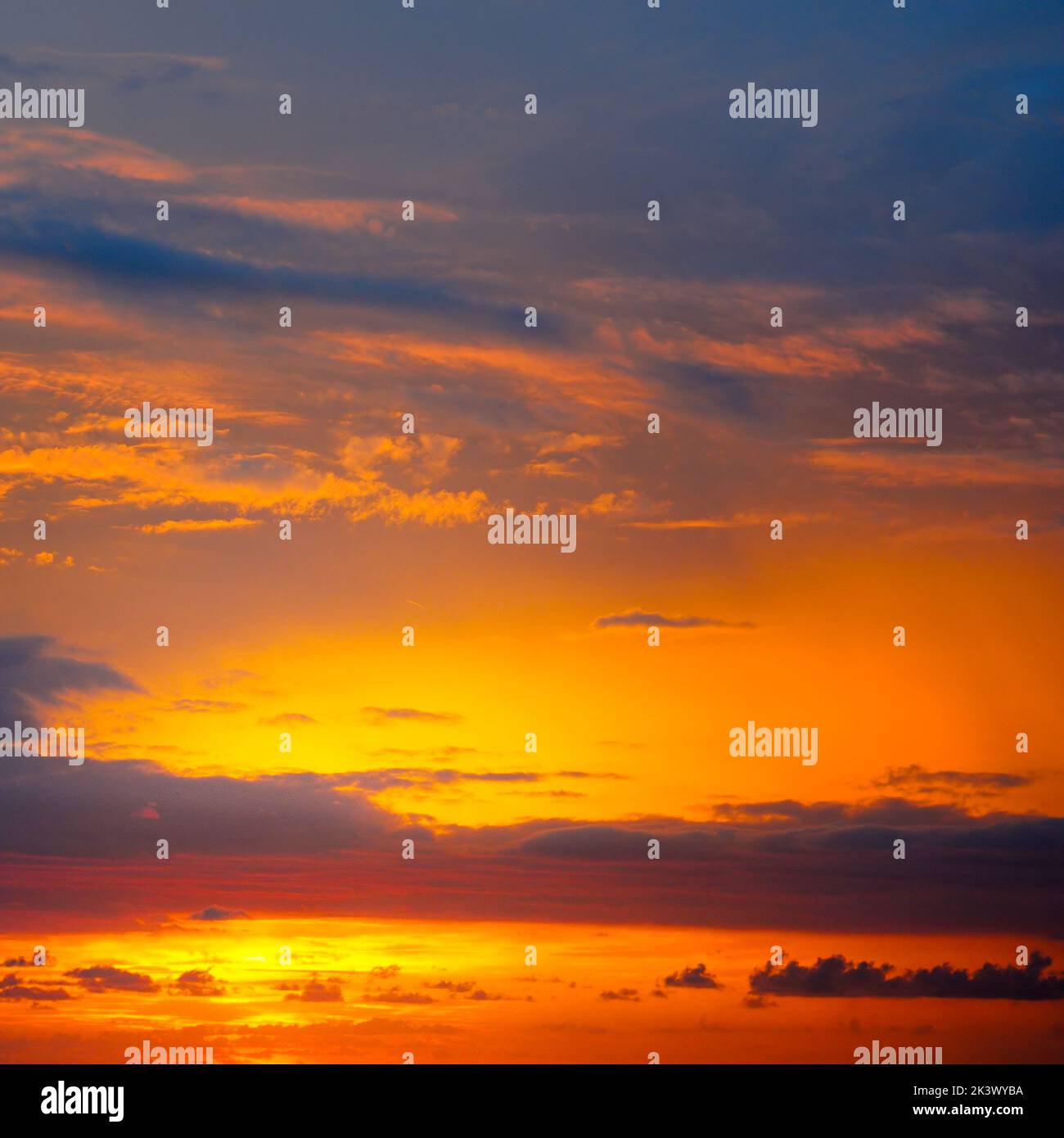 The sun's rays illuminate the sky above the horizon Stock Photo - Alamy