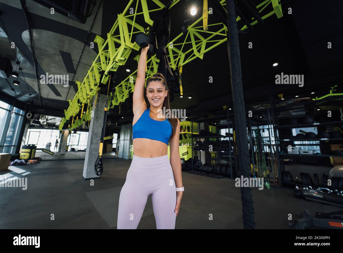 Beautiful strong woman exercises dumbbells hi-res stock photography and ...