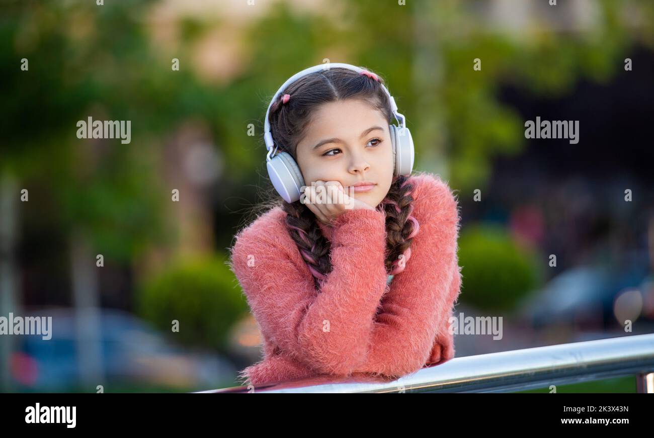 Teen girl thinking leaning on railing, thinking. Thoughtful teenager ...