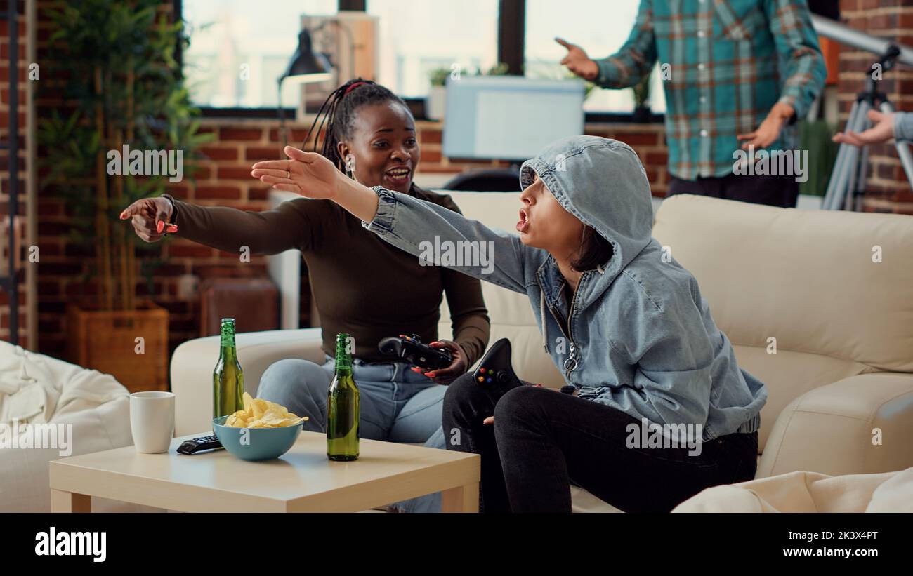 Frustrated women losing video games challenge on console, playing ...