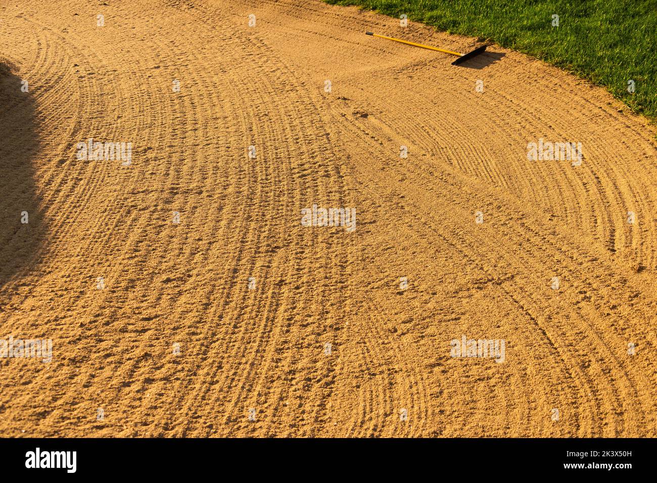 Raked out sand trap on a golf course in the morning Stock Photo - Alamy