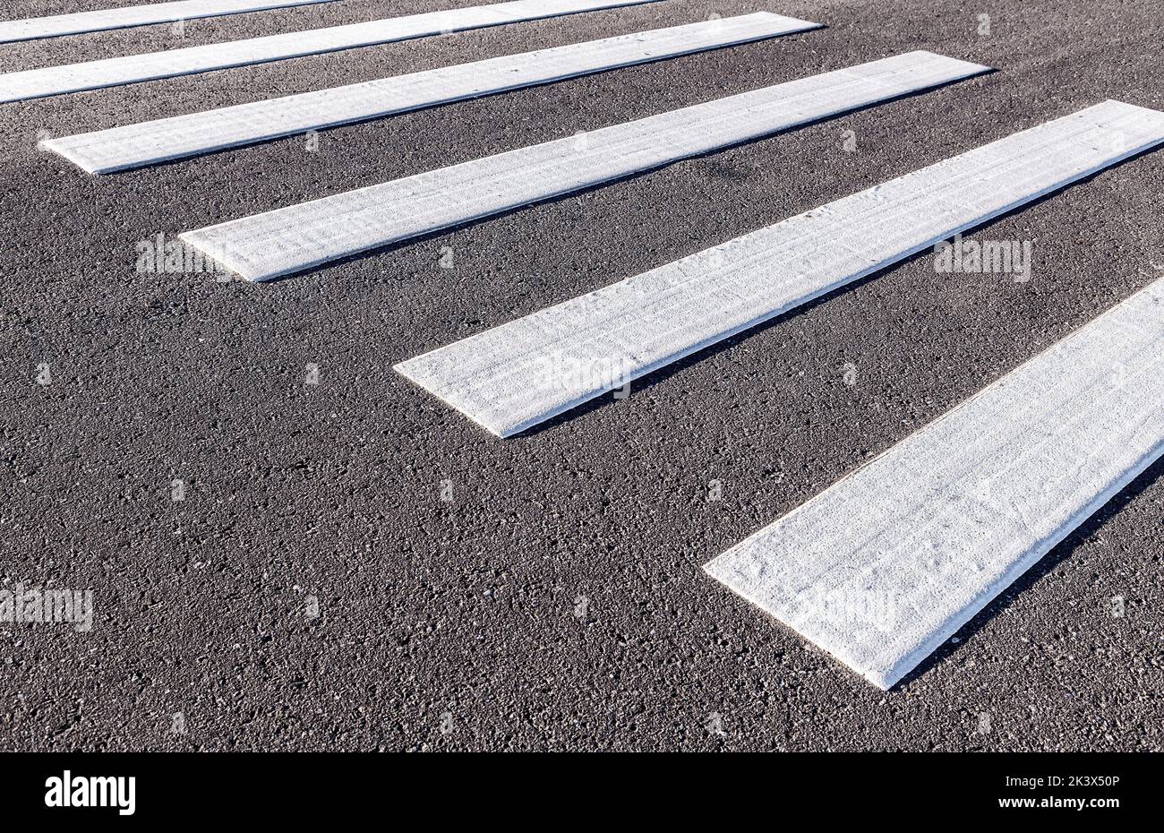 Pedestrian crossing with white marking lines on asphalt. Crosswalk on ...