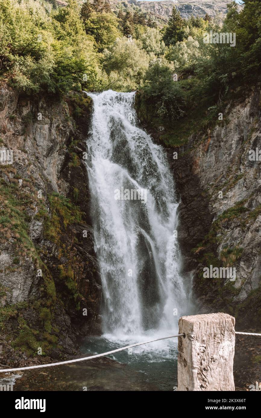 A beautiful landscape of a waterfall streaming from the middle of a ...