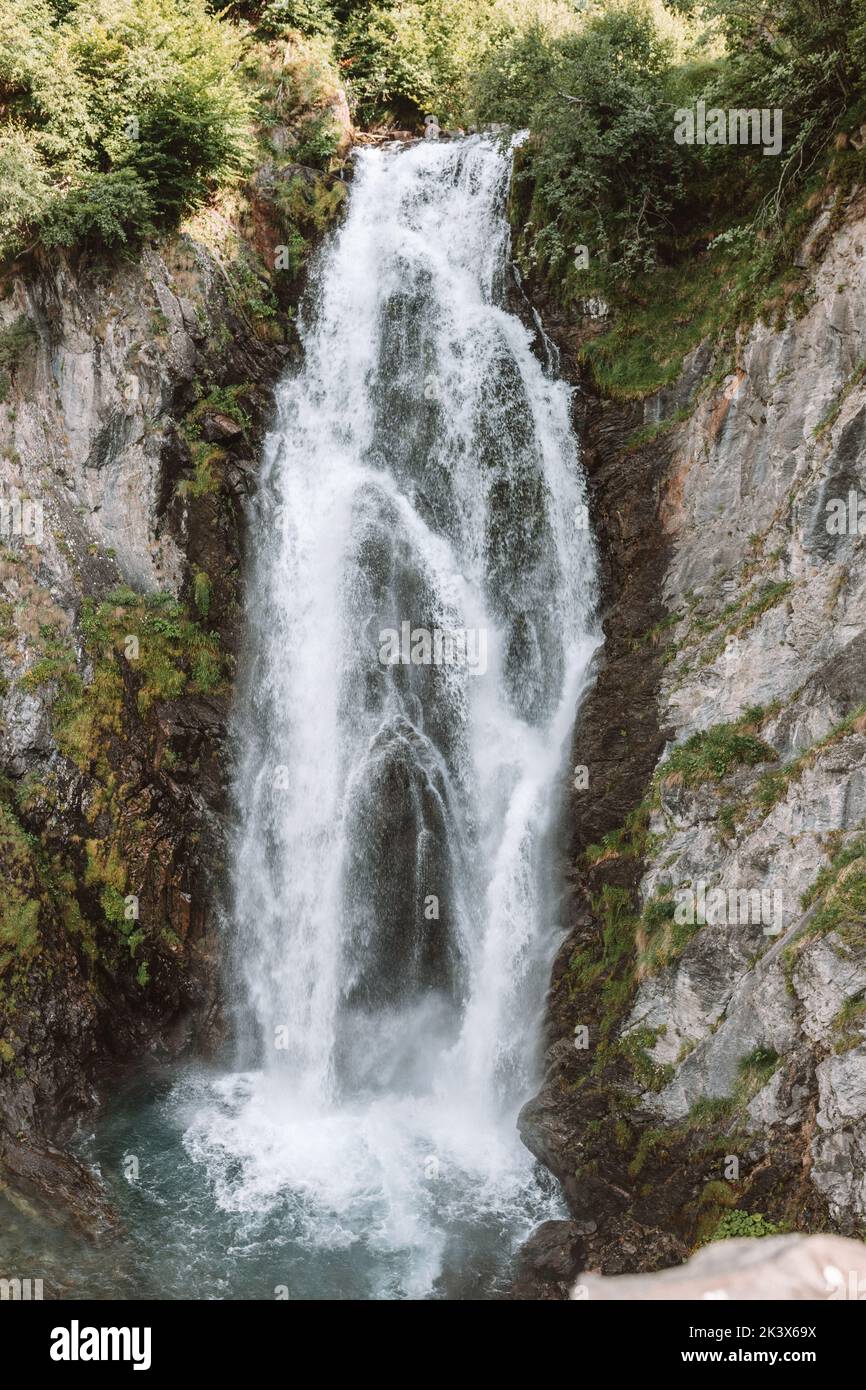 A beautiful landscape of a waterfall streaming from the middle of a ...