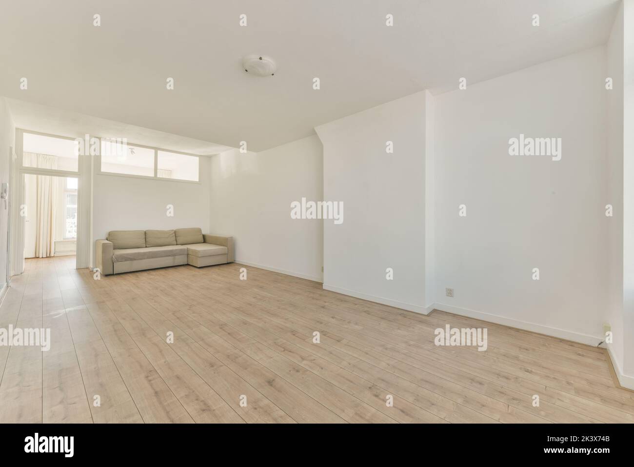 A cozy and spacious empty room only with one furniture Stock Photo - Alamy