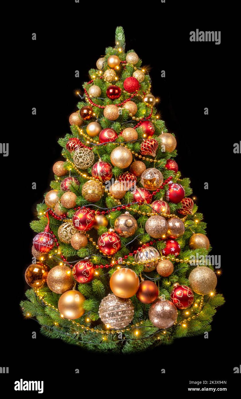 christmas tree with golden and red balls on black background Stock ...