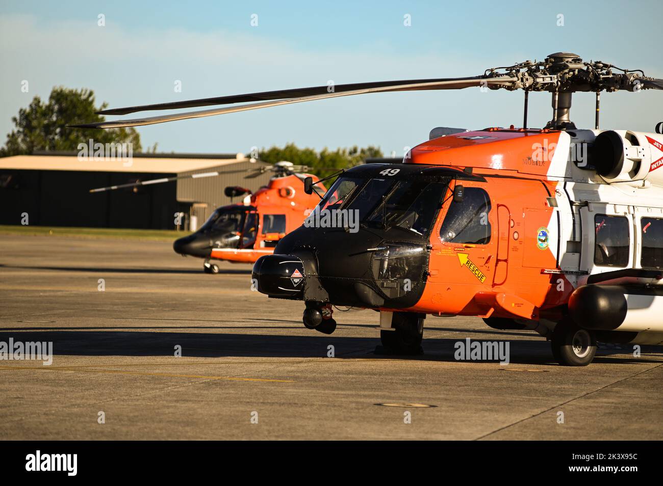 A Coast Guard MH-60 Jayhawk and MH-65 Dolphin helicopter are staged on ...