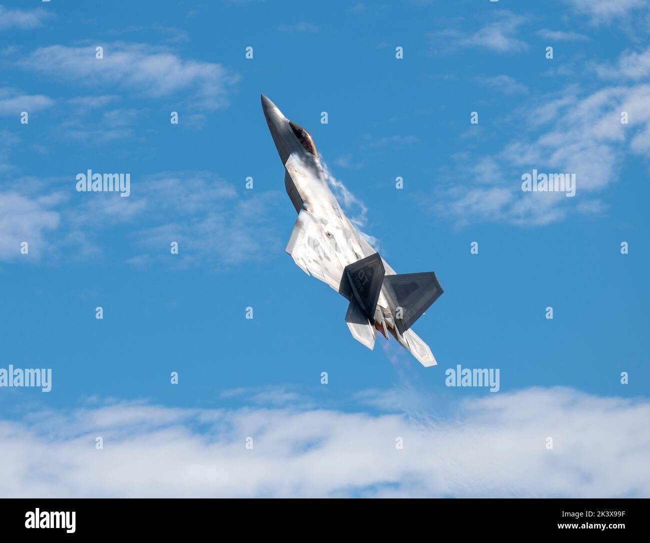 A U.S. Air Force F-22 Raptor conducts a heritage flight during the 2022 ...