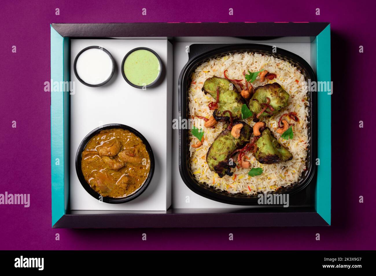 A top view of an Asian dish with rice and sauces in containers Stock ...