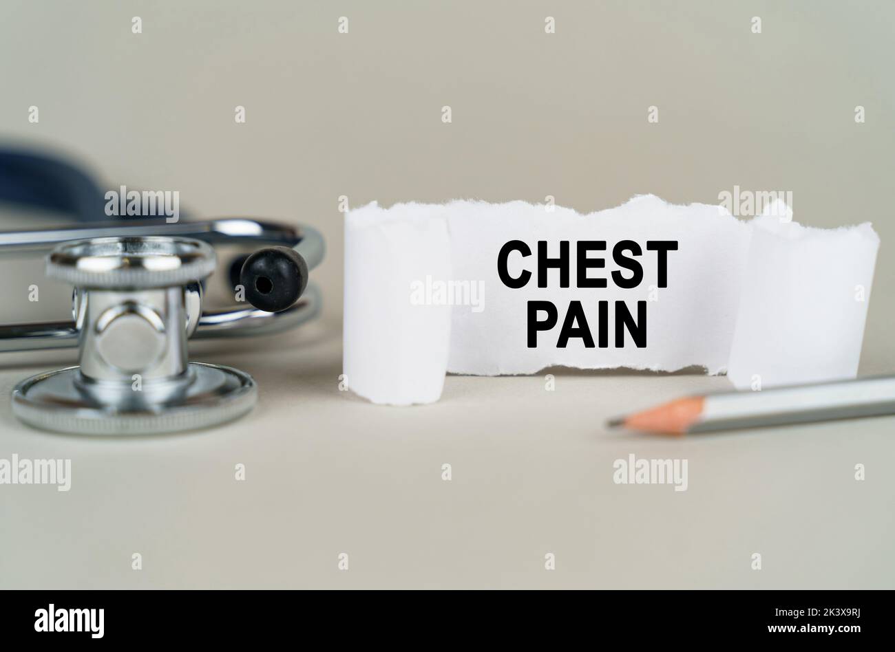 Medical concept. On a gray background, a stethoscope, a pencil and a ...