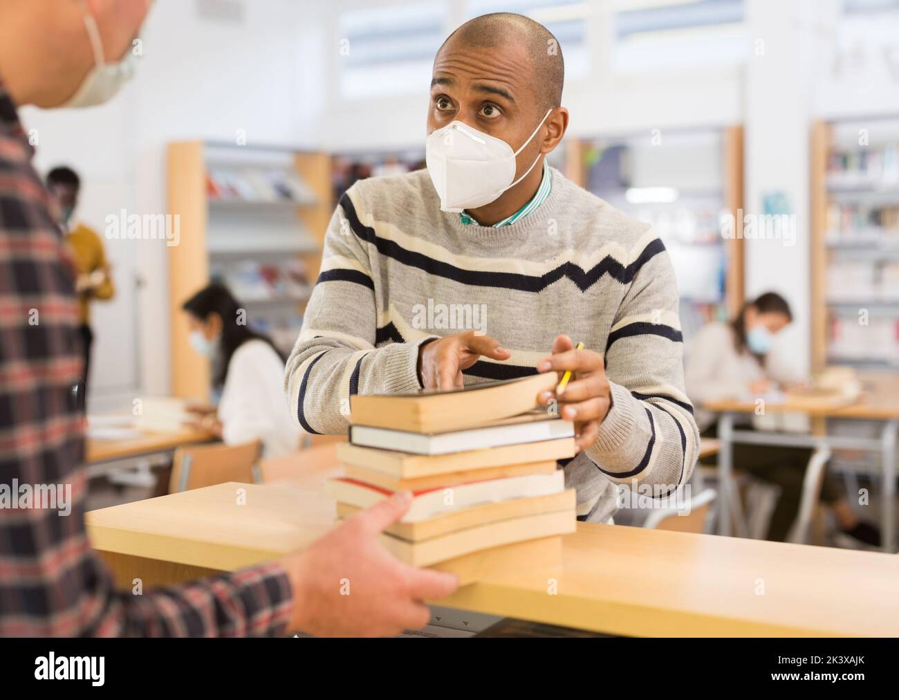 Returning book library hi-res stock photography and images - Alamy