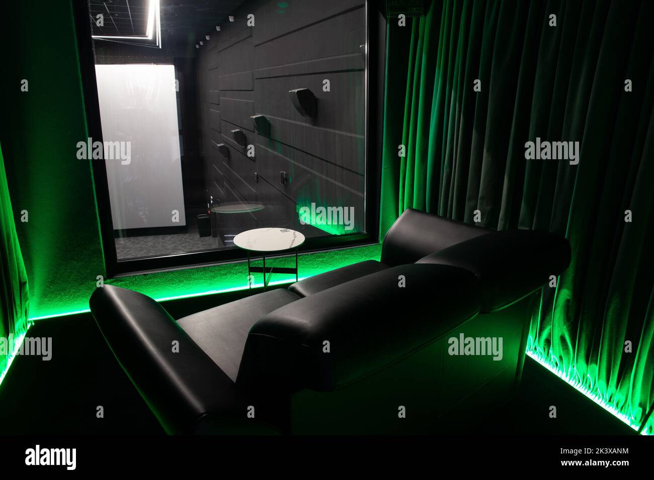 The interior of a private cinema booth in a public cinema. Comfortable ...