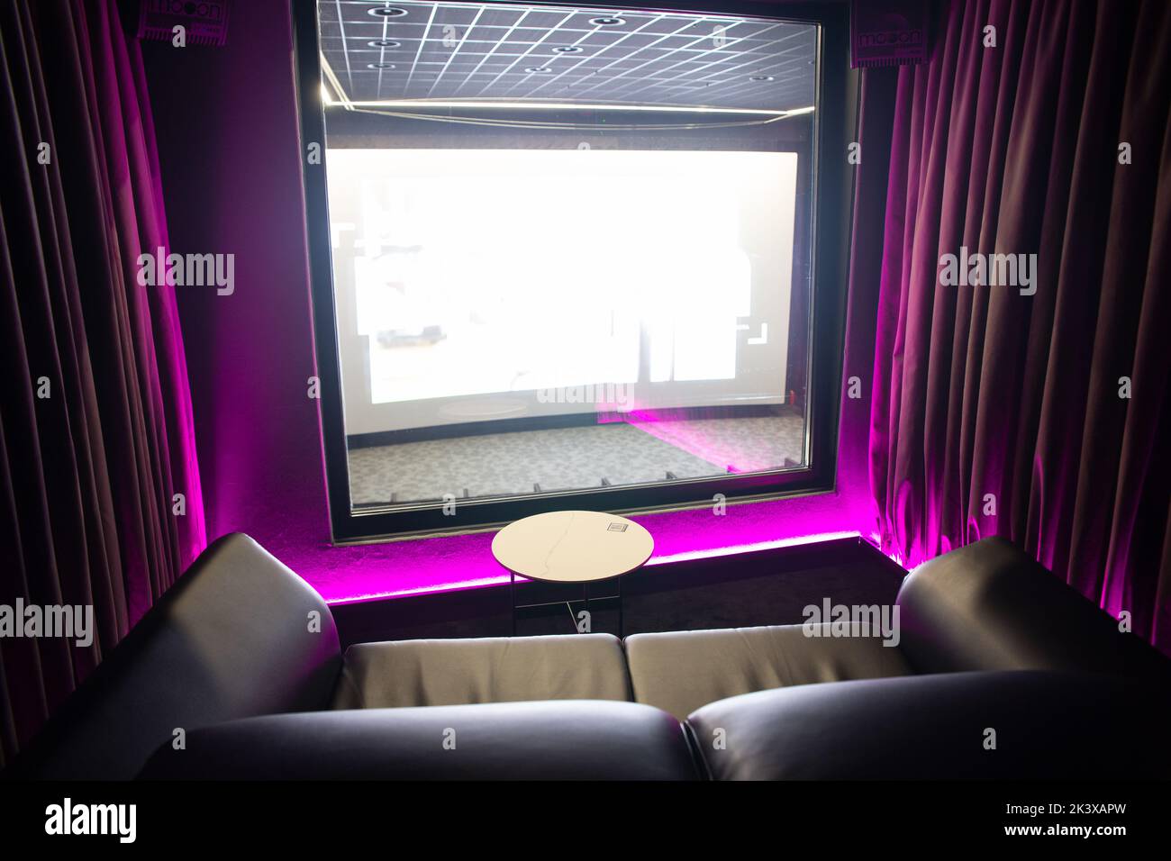 The interior of a private cinema booth in a public cinema. Comfortable ...