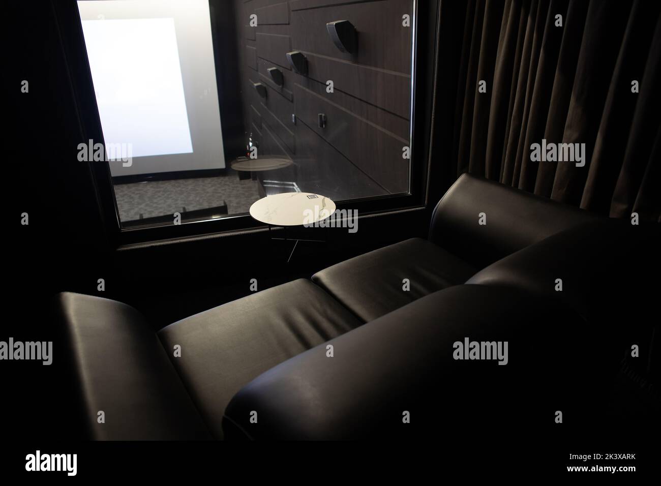 The interior of a private cinema booth in a public cinema. Comfortable ...