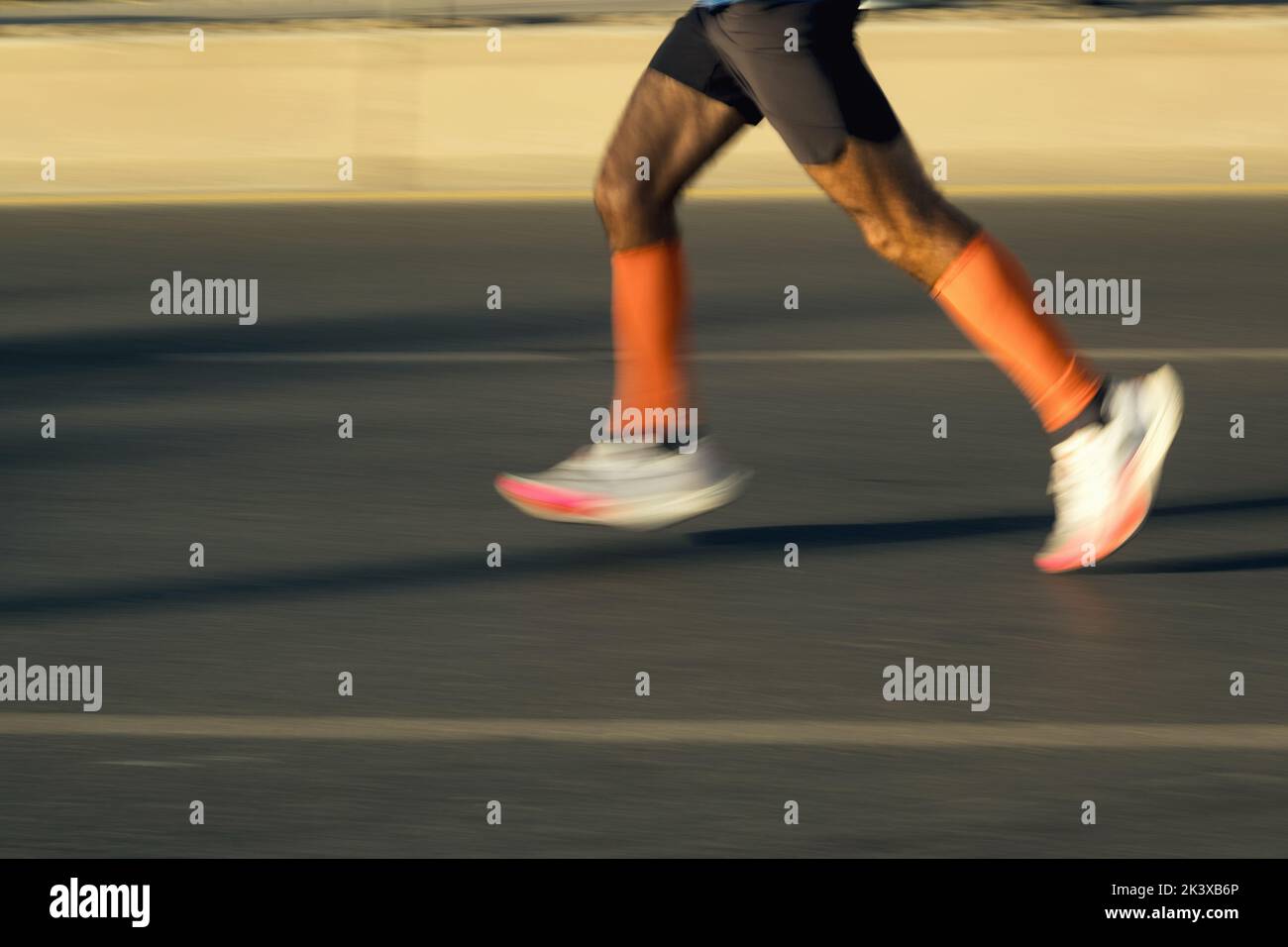 Close up shot feet of the Competitors running in the half marathon are ...