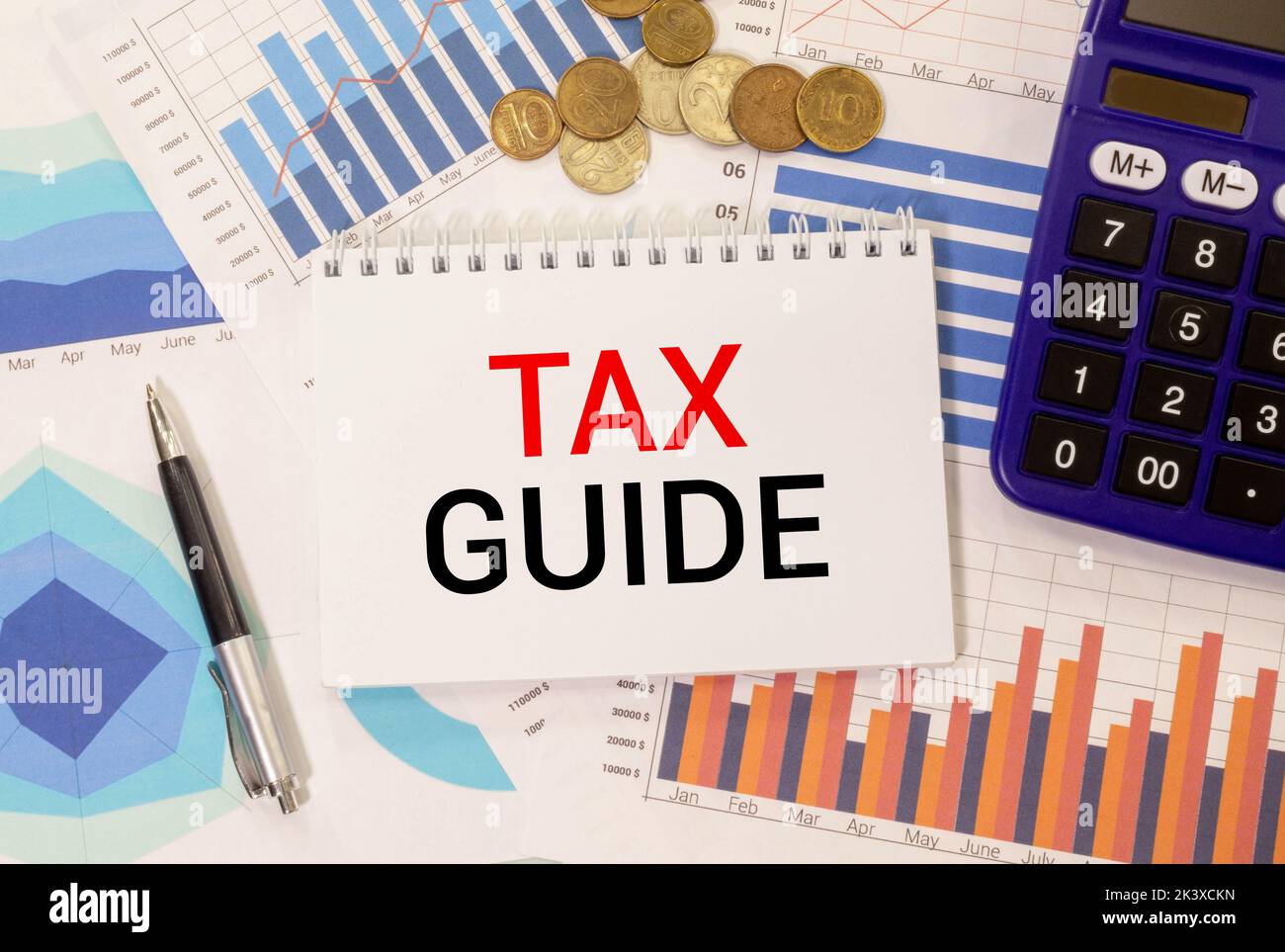Calculator with text Tax Guide. Calculator, currency, book, bills and ...