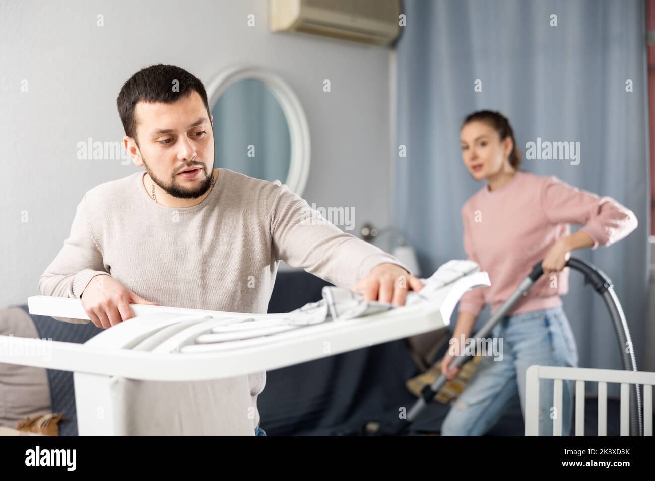Young couple dusting home hi-res stock photography and images - Alamy