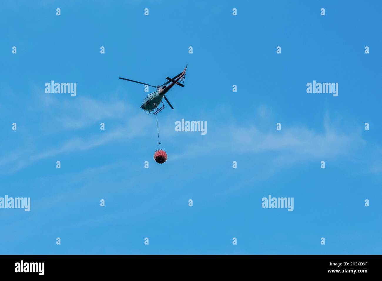Annecy, france - september 2022: Distant helicopter carrying sack of ...