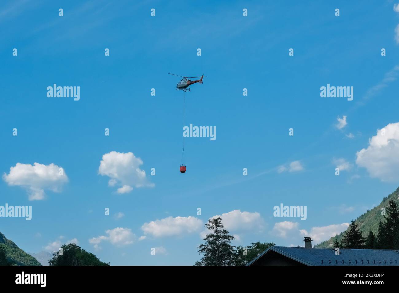 Annecy, france - september 2022: Distant helicopter carrying sack of ...