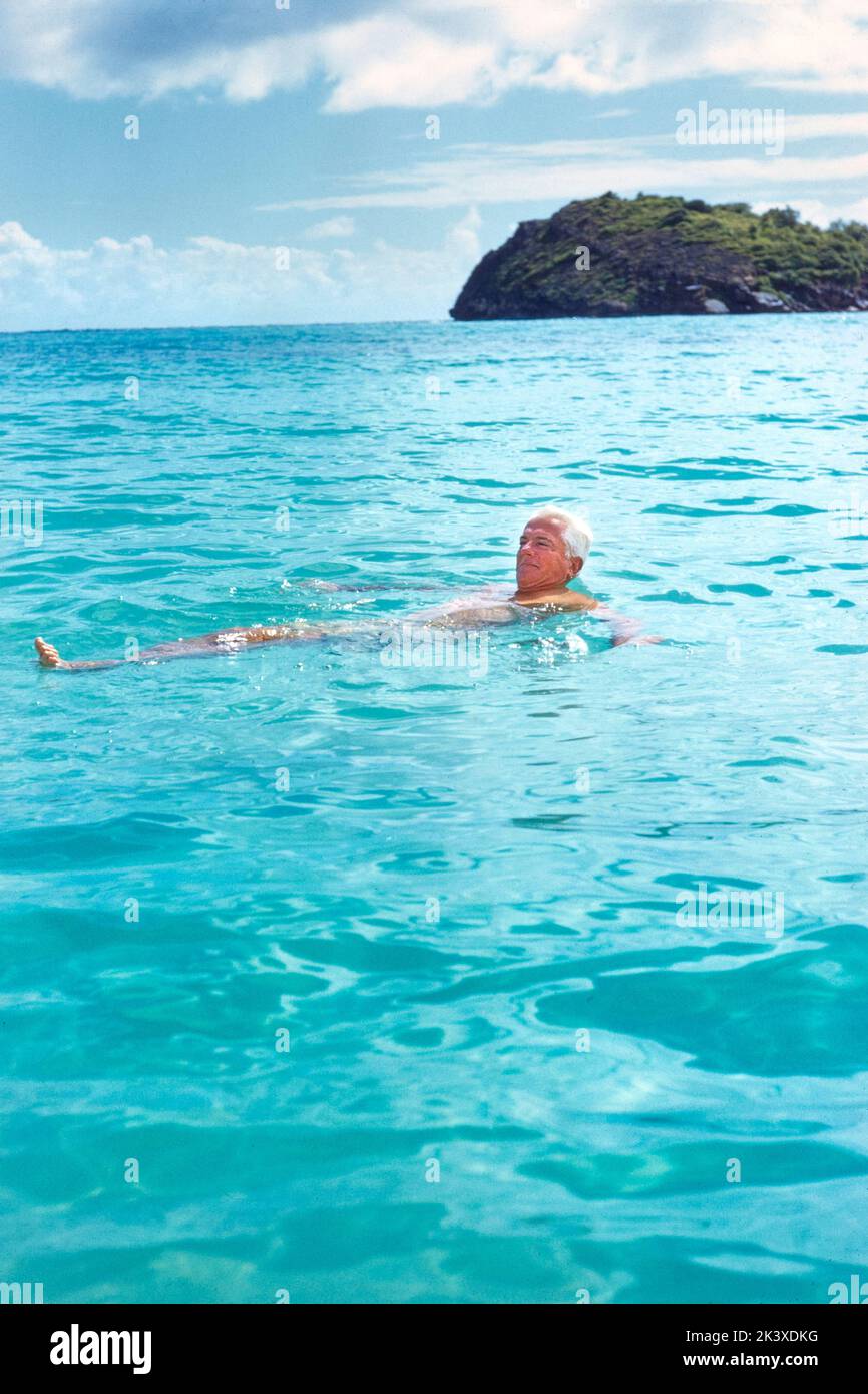 Man floating on Back in Water, Antigua, Lesser Antilles, Antigua and ...